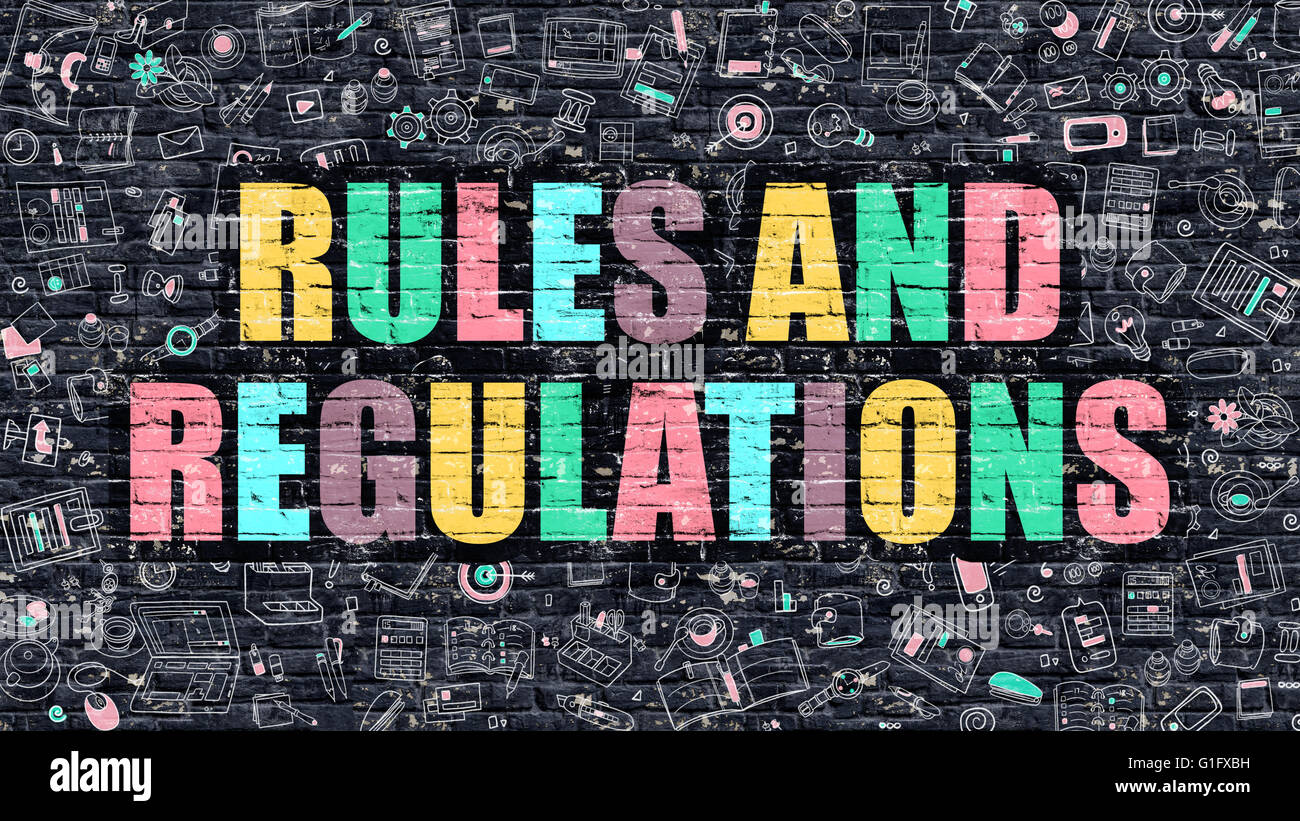 Rules and Regulations on Dark Brick Wall Stock Photo - Alamy