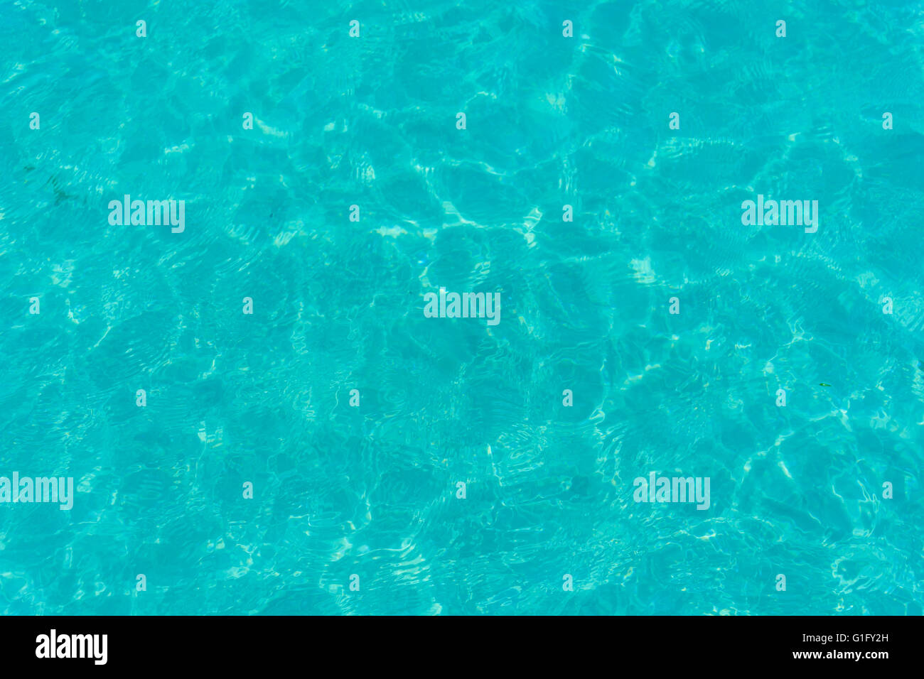 Transparent turquoise sea water with ripples background Stock Photo - Alamy