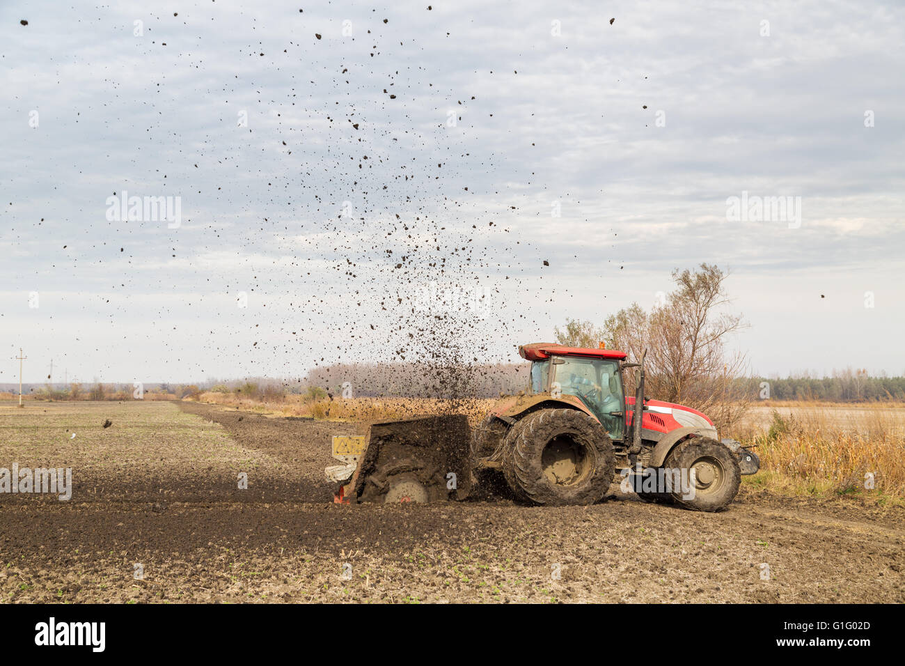 Tractor with double wheeled ditcher digging drainage canal Stock Photo ...