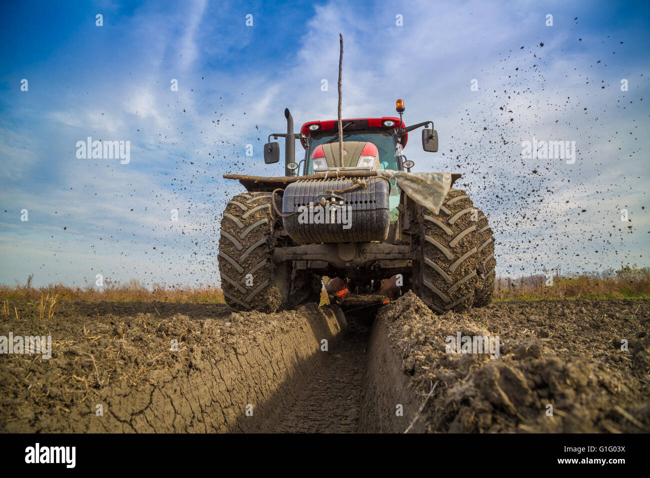 Tractor with double wheeled ditcher digging drainage canal Stock Photo ...