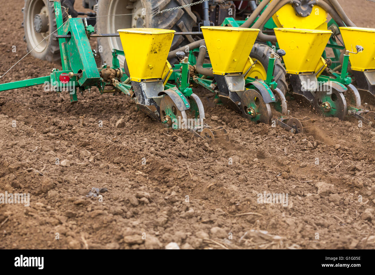 Farmer seeding, sowing crops at field Stock Photo - Alamy
