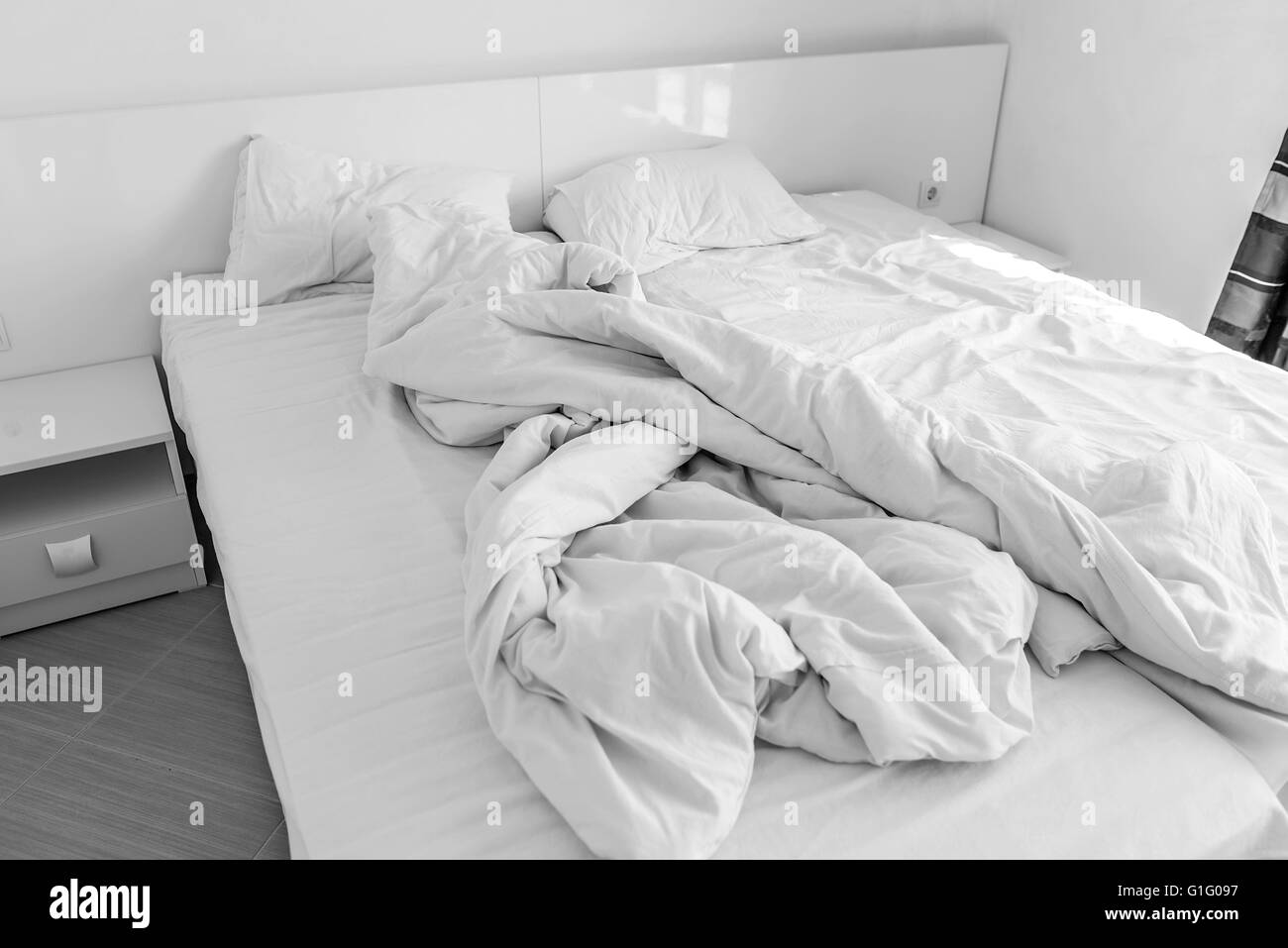 Empty crumpled bed. Double bed with crumpled bed Stock Photo - Alamy