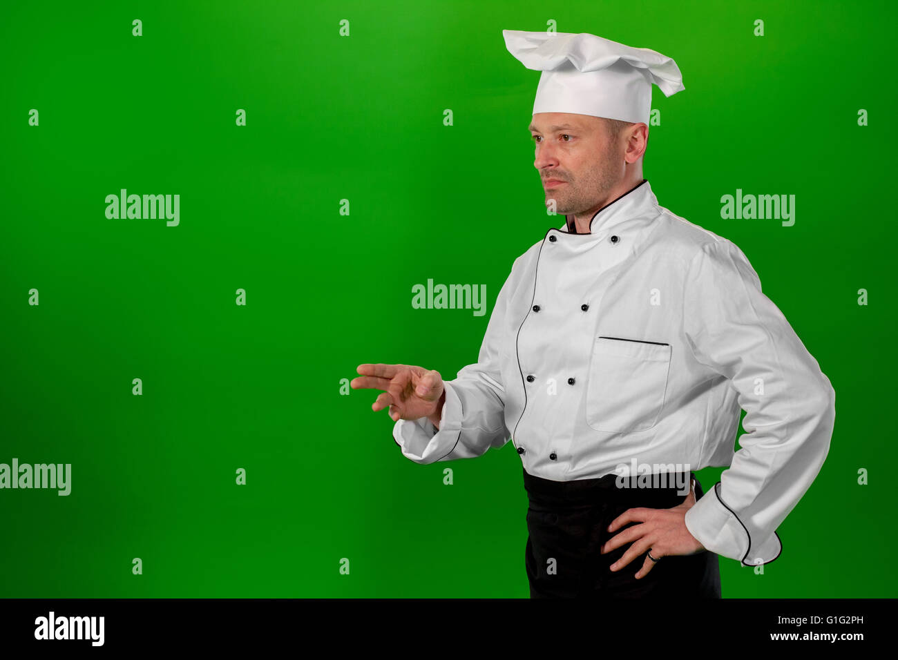 serious chef standing with his arms crossed Stock Photo - Alamy