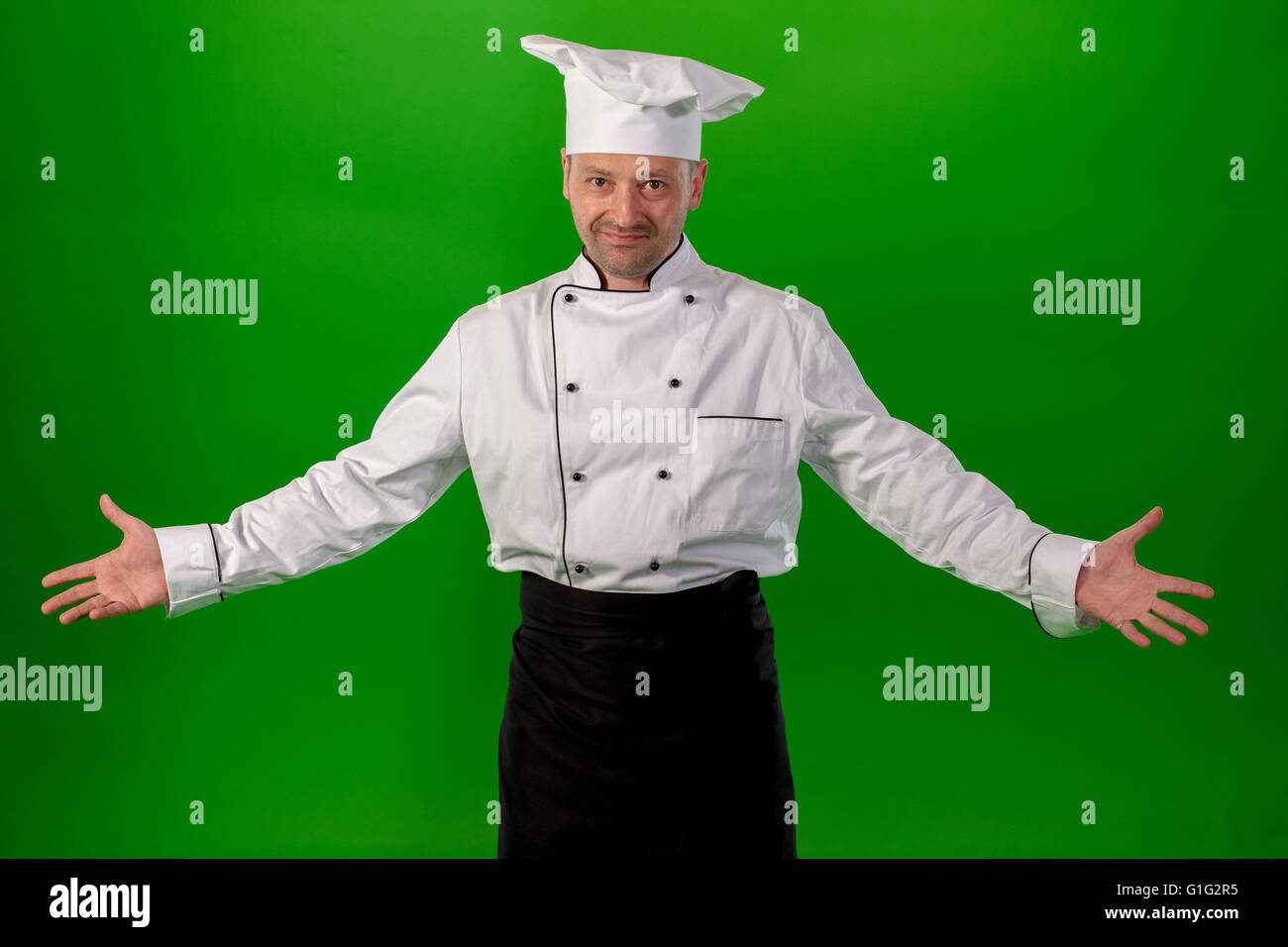serious chef standing with his arms crossed Stock Photo - Alamy