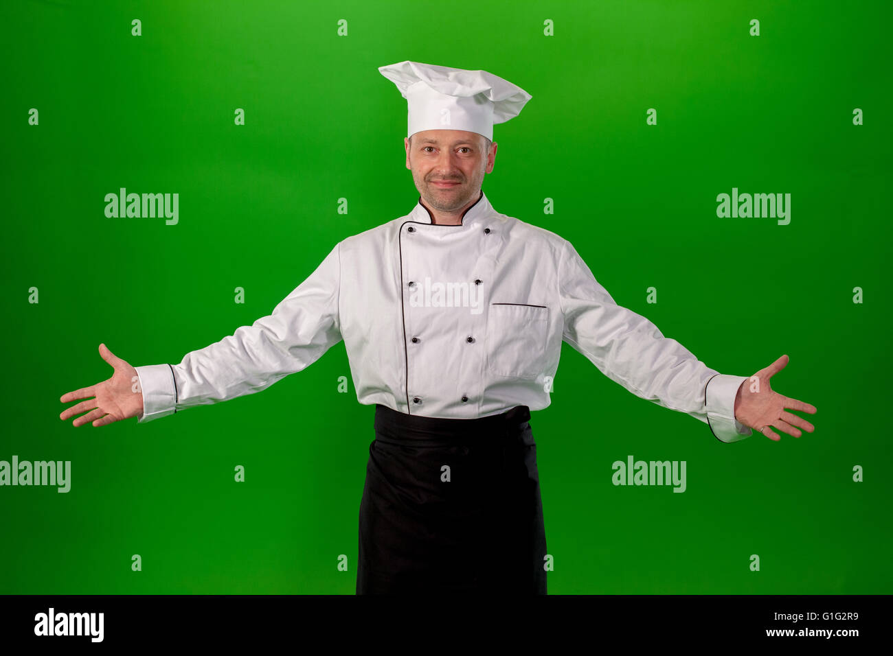 serious chef standing with his arms crossed Stock Photo - Alamy