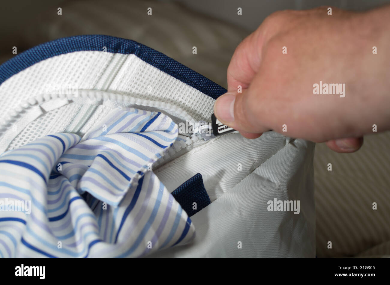 Zipping hi-res stock photography and images - Alamy