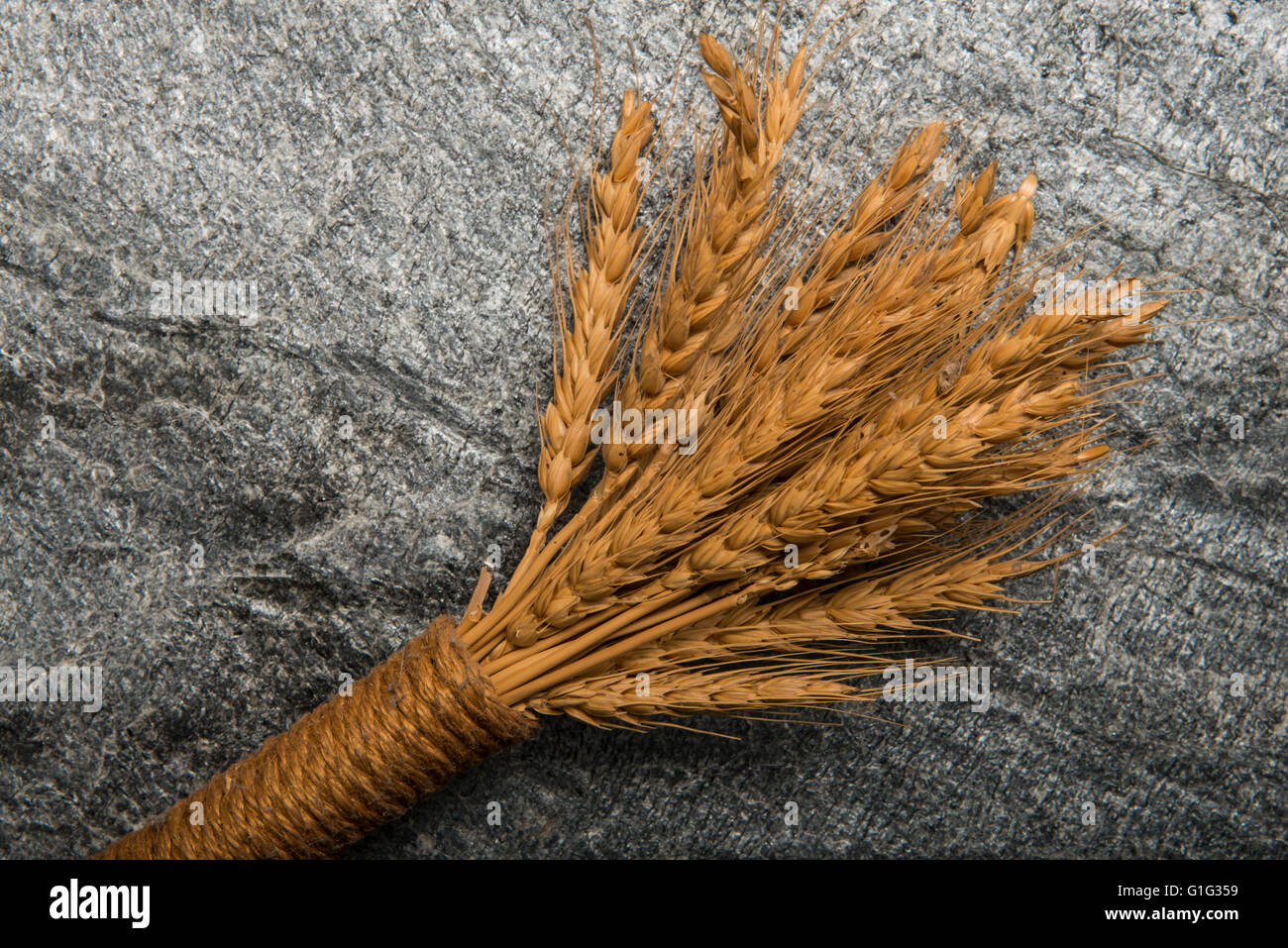 Dried wheat and straw on stone background Stock Photo - Alamy