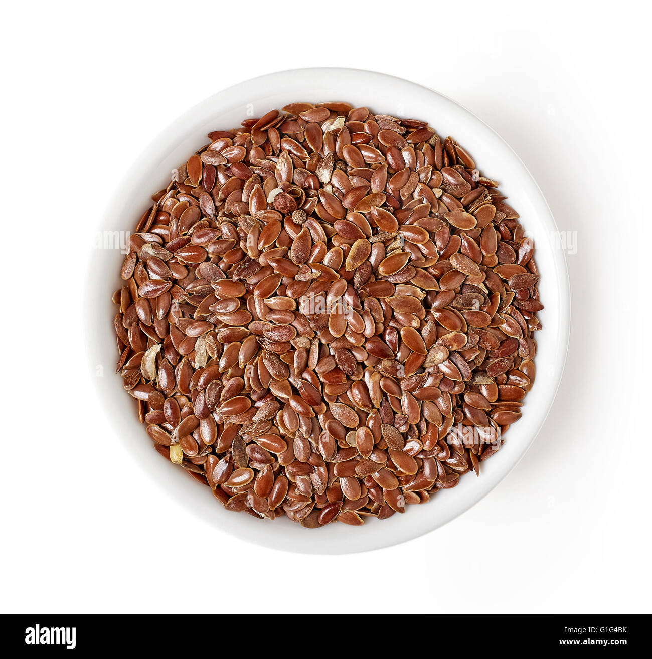 Bowl of flax seeds isolated on white background, top view Stock Photo - Alamy