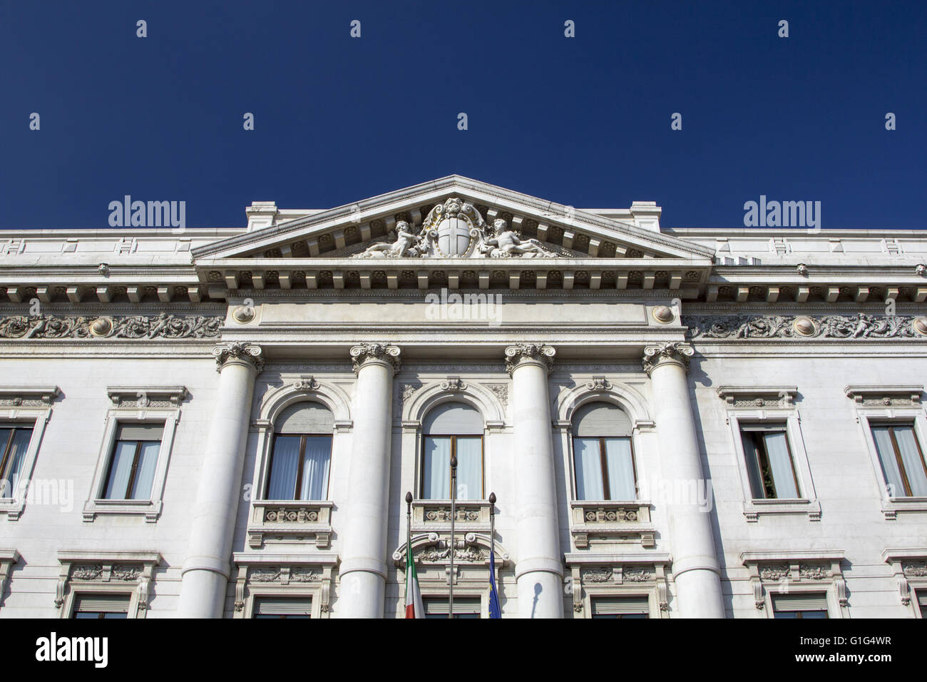 Old and classic bank building, front view on a blue sky Stock Photo - Alamy