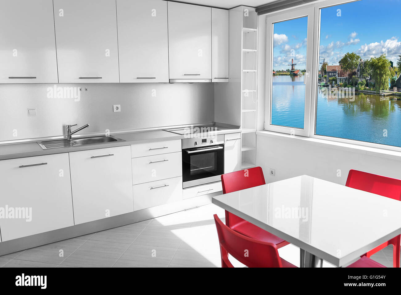 Modern white kitchen interior with lake view in the window Stock Photo ...