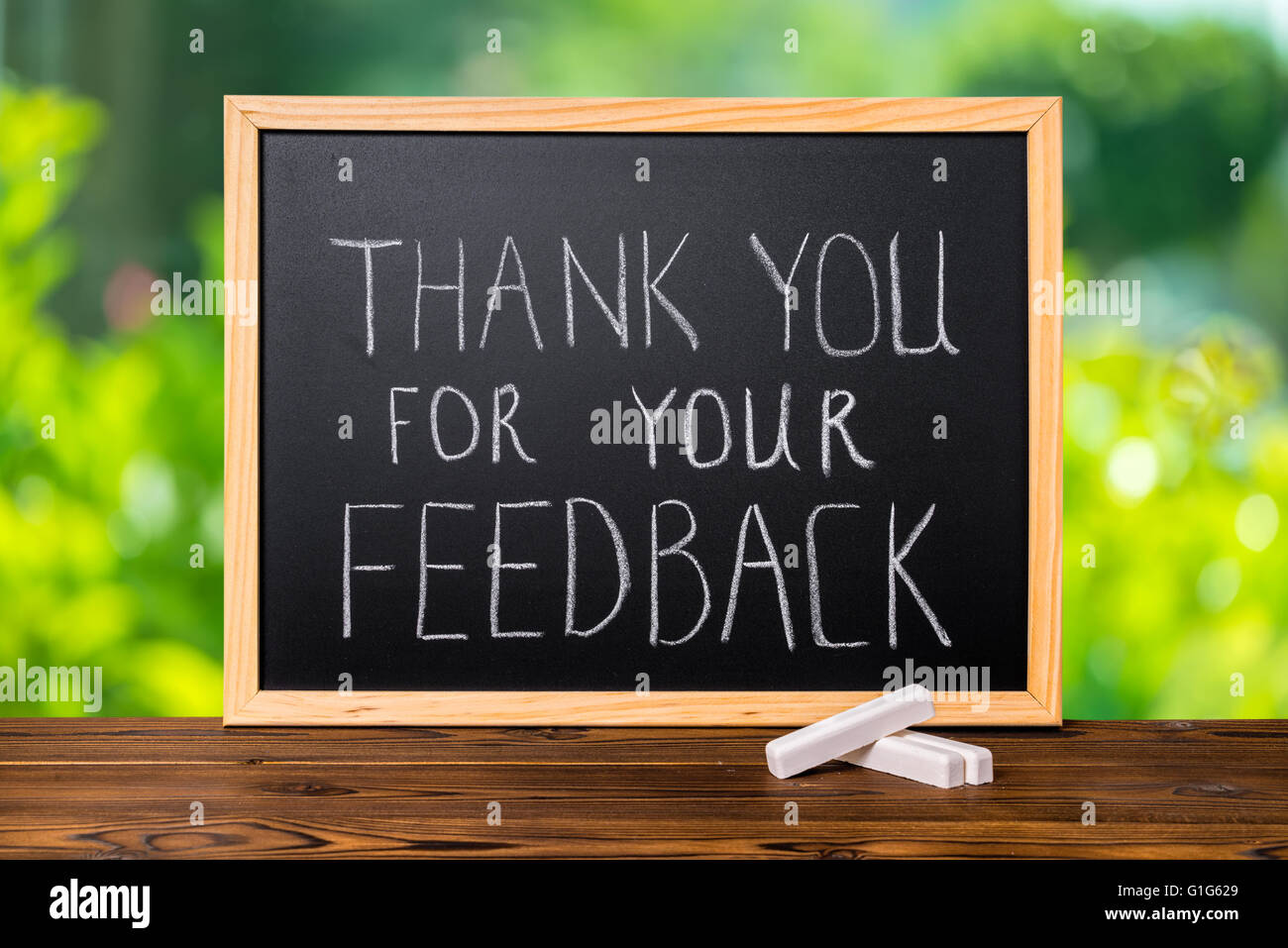 handwriting text thank you for your feedback is written in chalkboard ...