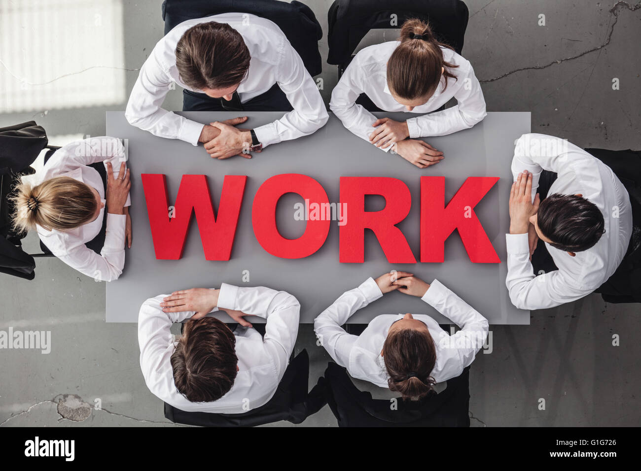 Group work colleagues sitting table hi-res stock photography and images ...