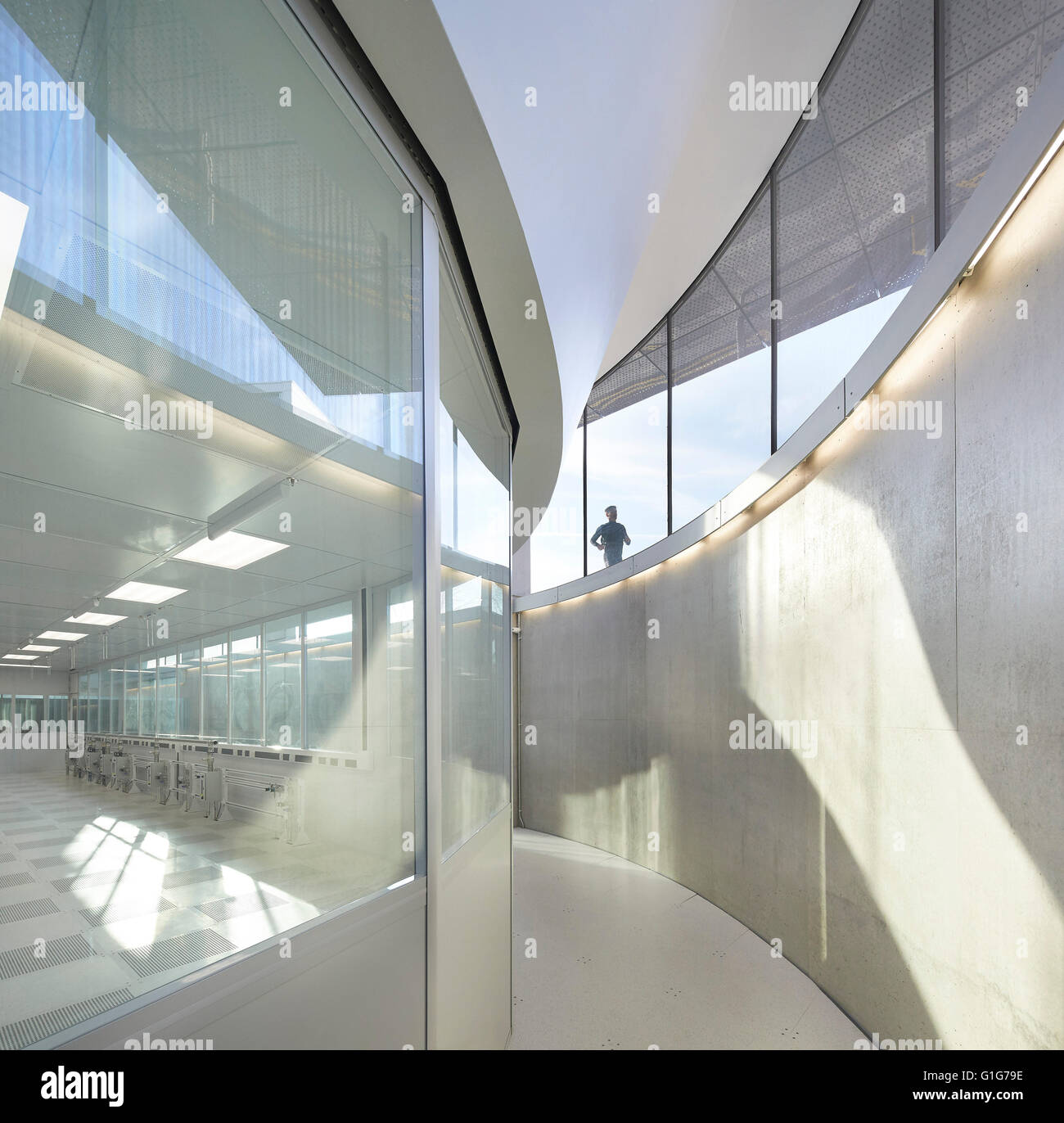 Curved basement viewing corridor with fenestration to cleanroom and ...