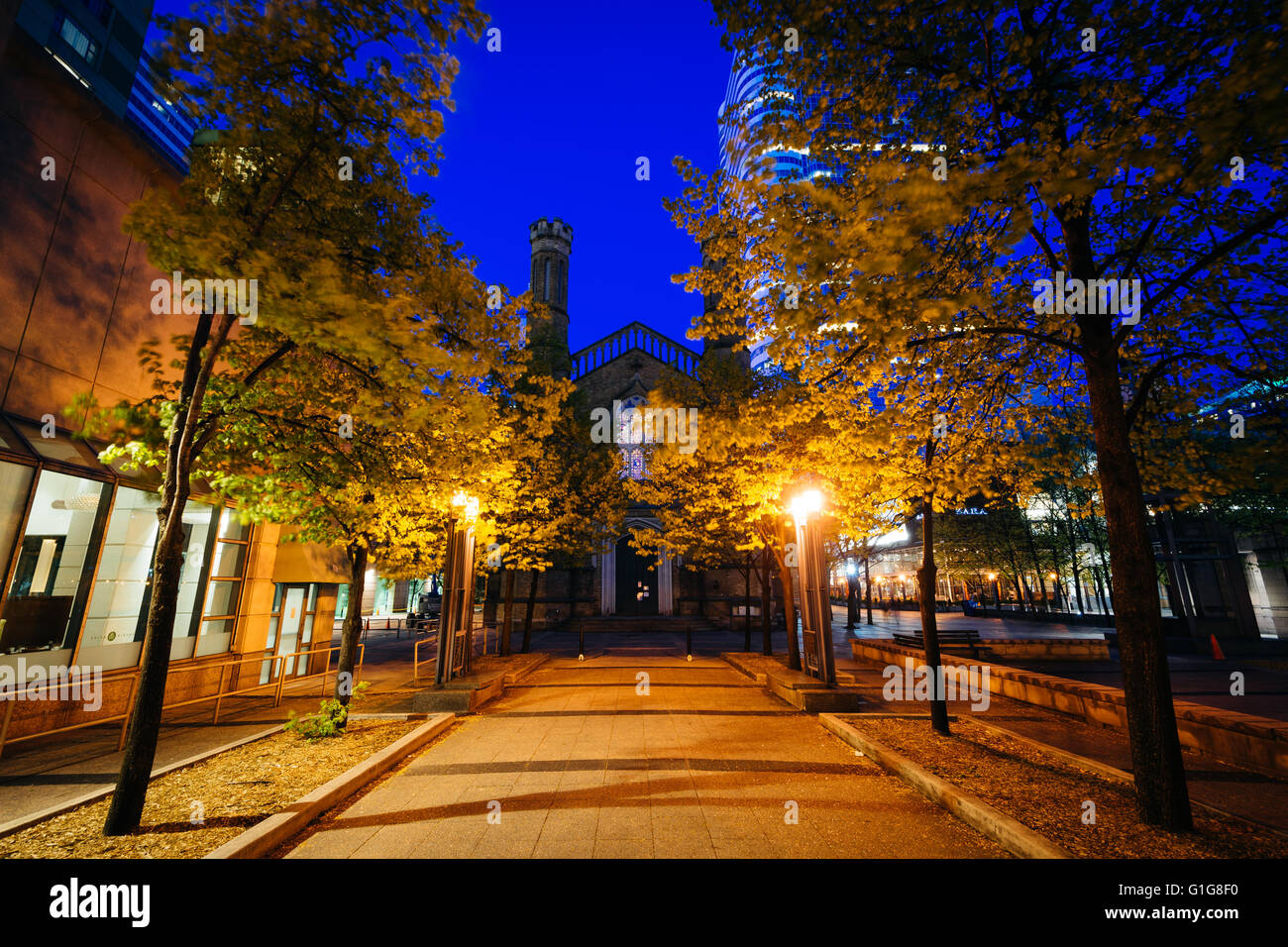 Walkway and the Church of the Holy Trinity at Trinity Square at night ...
