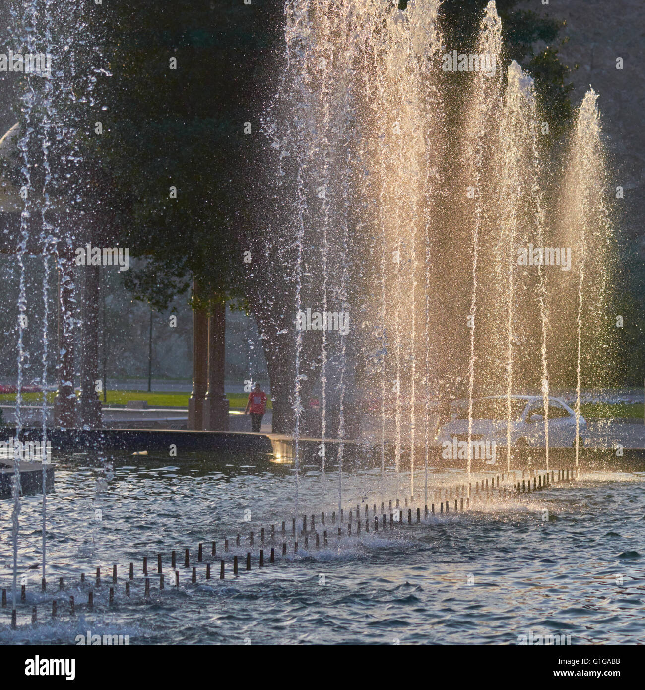 Fountains glowing in the early morning sun Stock Photo - Alamy