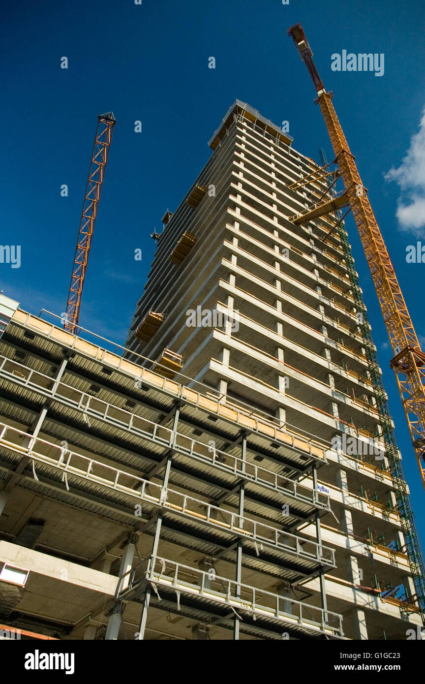Tall crane building the skyscraper in downtown Stock Photo - Alamy