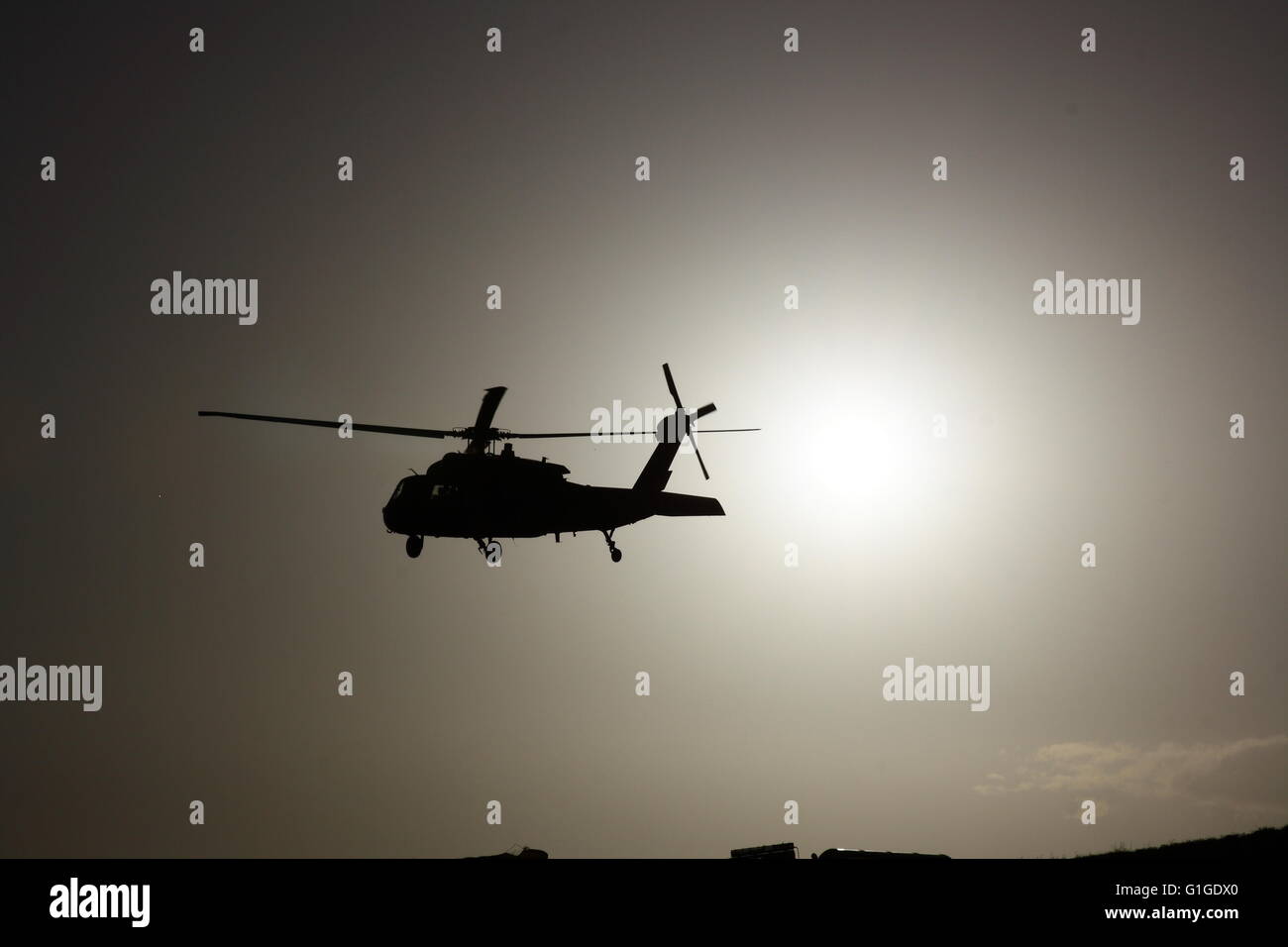 Helicopter at sunset with sun view Stock Photo - Alamy