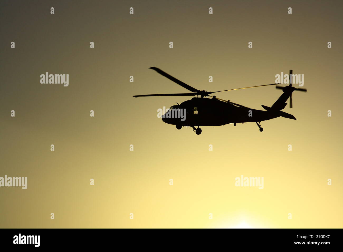 Helicopter pilot flying sunset hi-res stock photography and images - Alamy