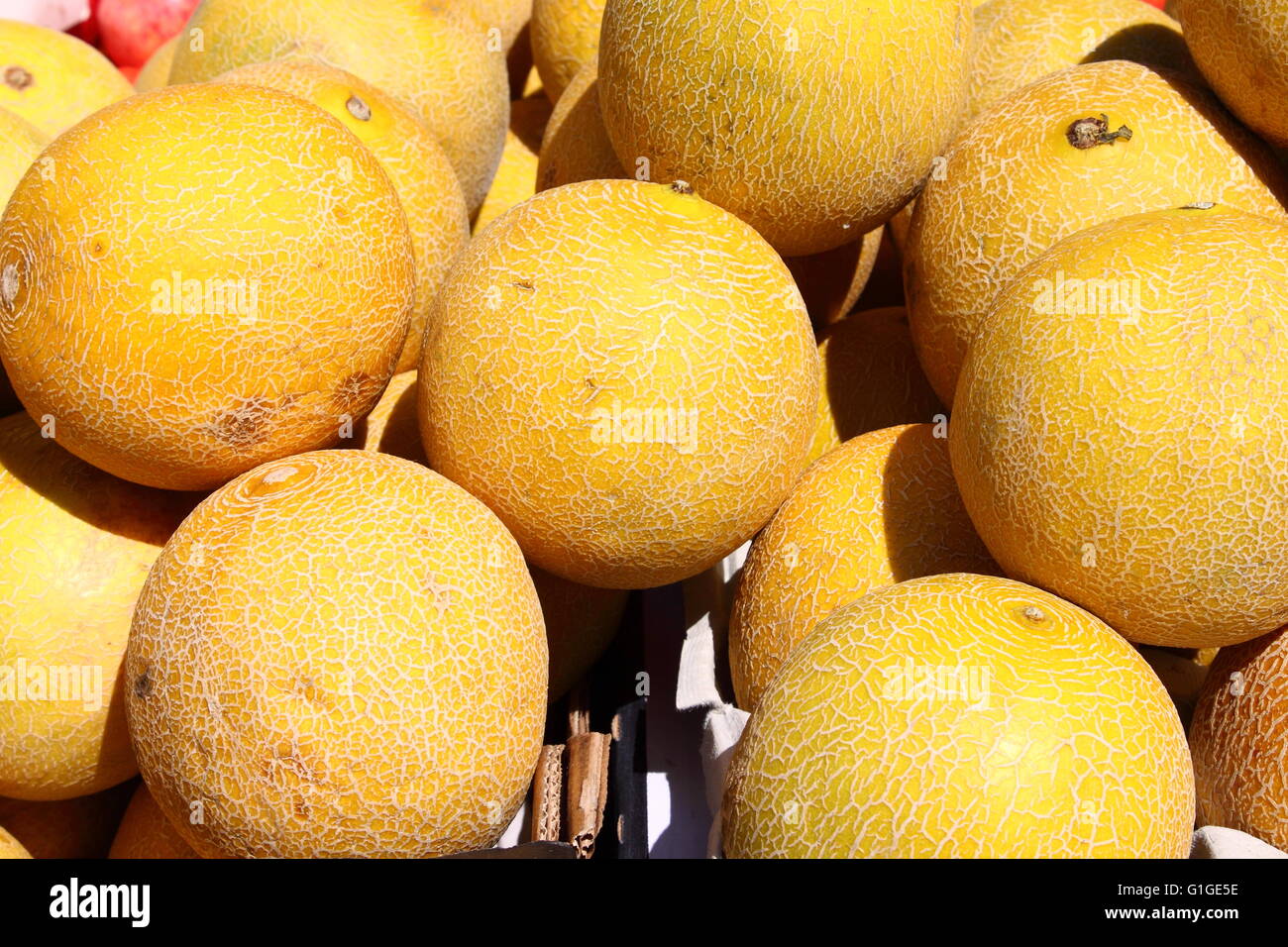 Fresh yellow melons displayed in a greengrocery Stock Photo - Alamy