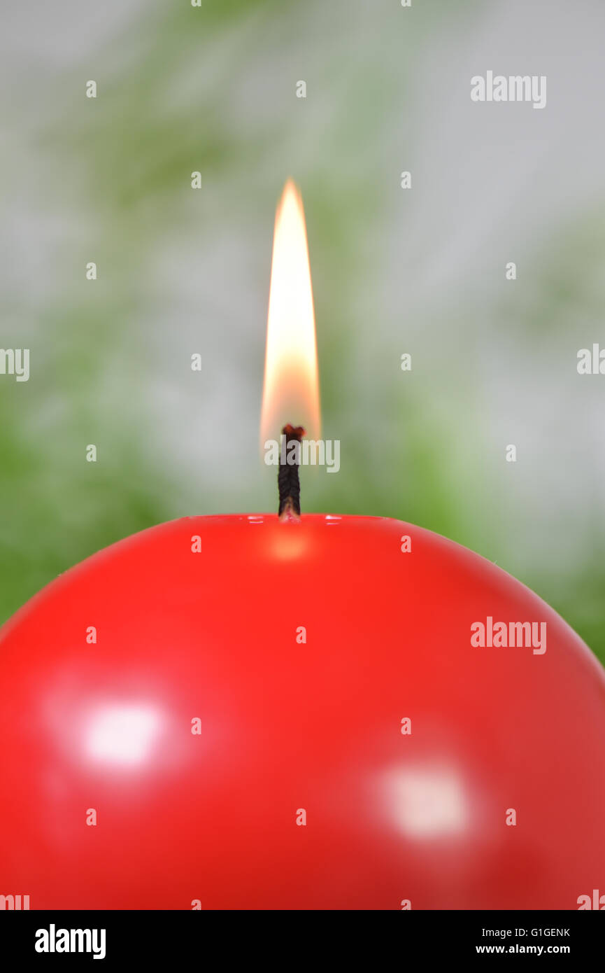 Burning candles Green and red candles studio shoot Stock Photo - Alamy