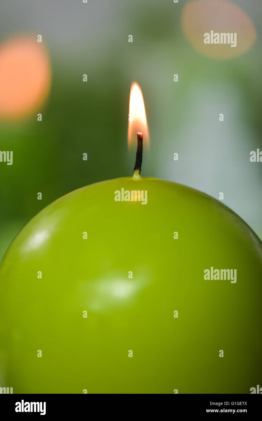 Burning candles Green and red candles studio shoot Stock Photo - Alamy