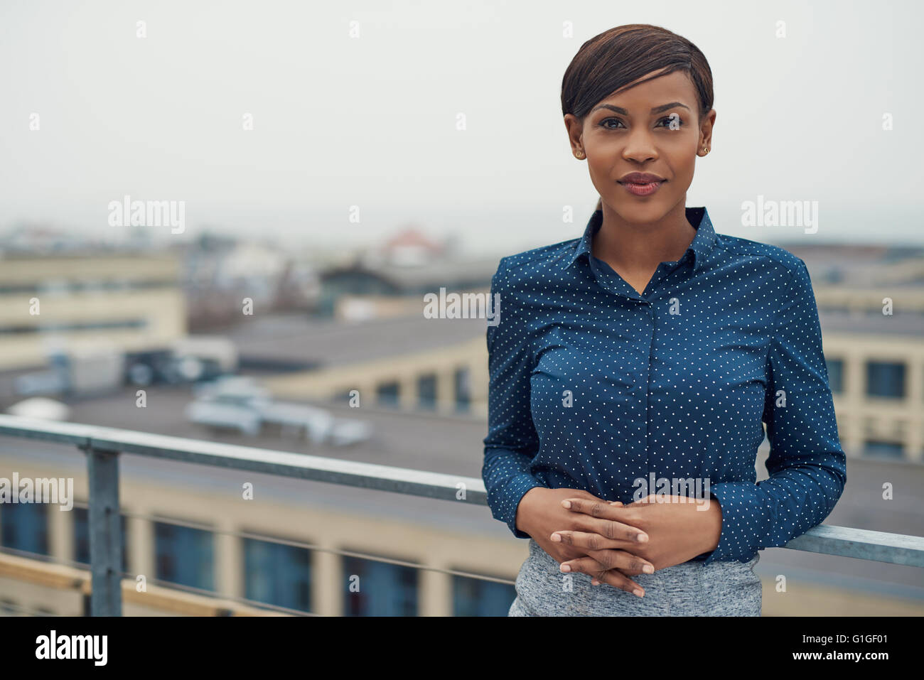 Leaning against railing hi-res stock photography and images - Alamy