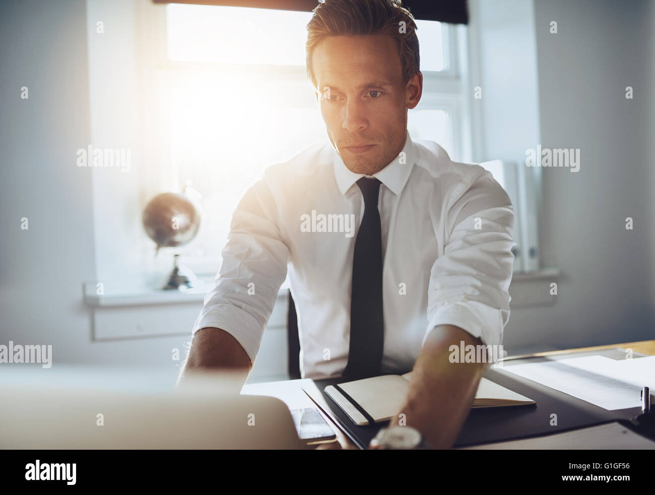 Business man working on laptop looking concentrated at the computer ...