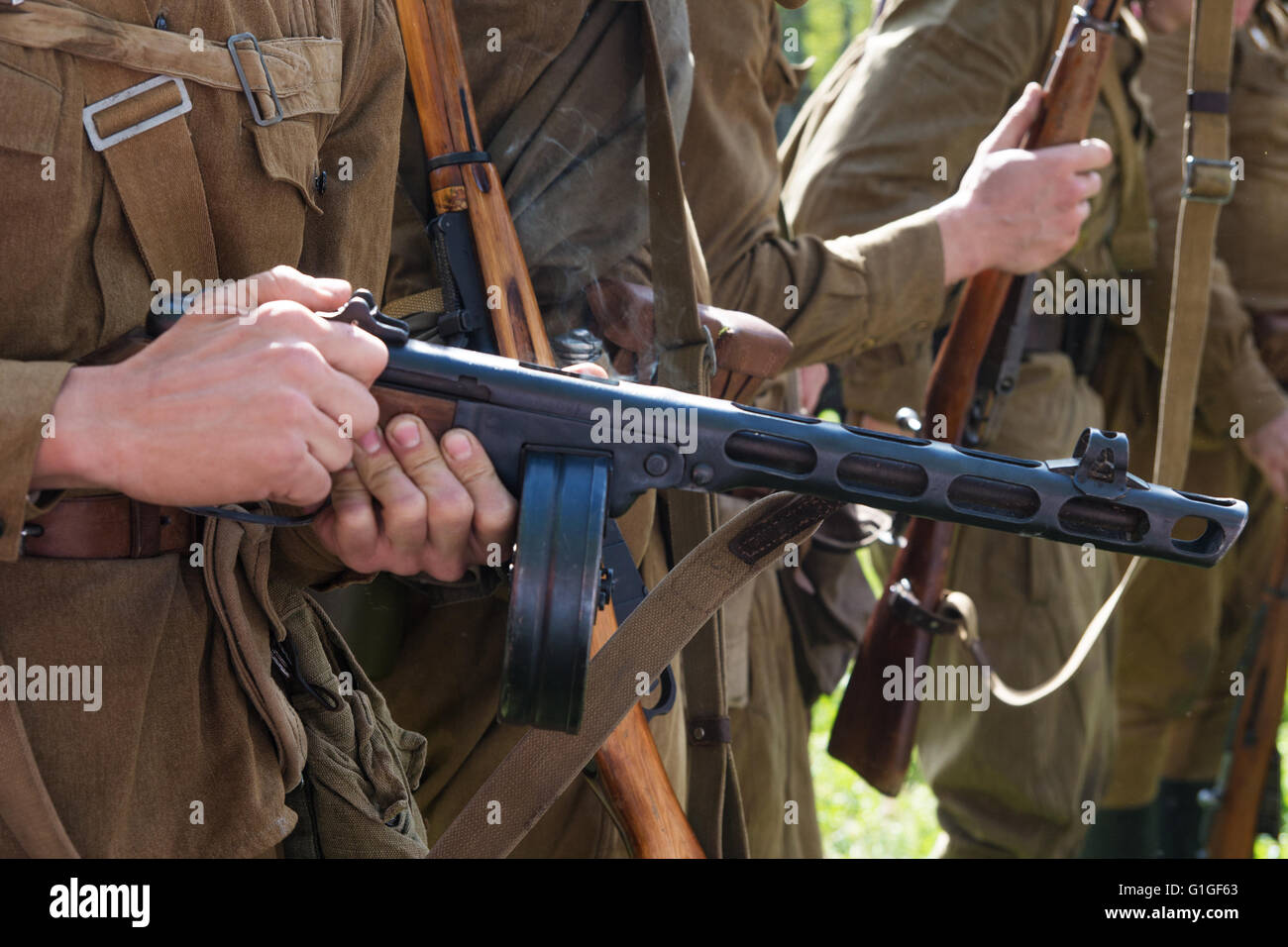 Russian machine gun in the hands of a soldier Stock Photo - Alamy