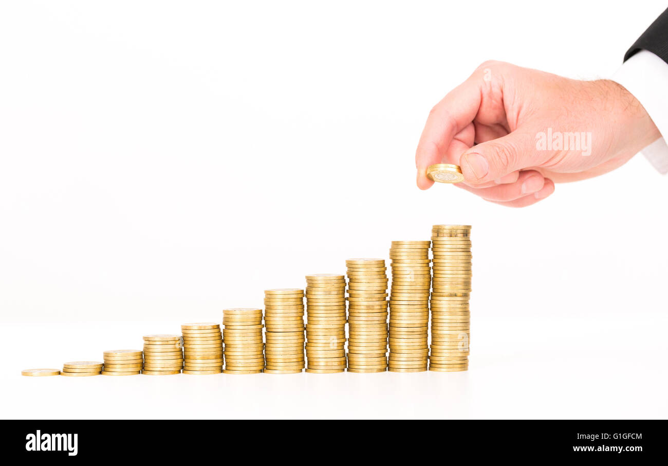 Saving money concept. Businessman hand putting money coin stack growing ...