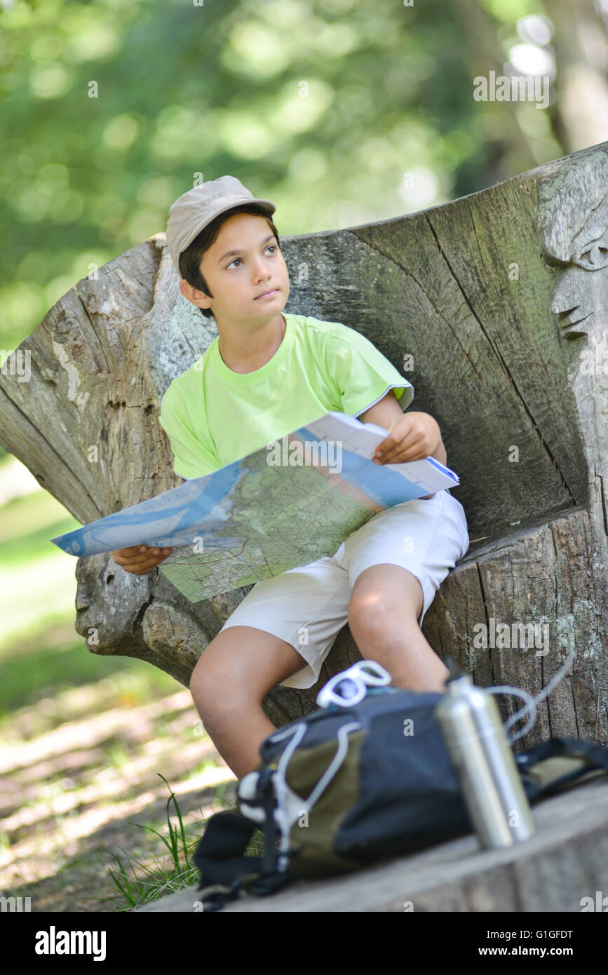 Young boy seeking his path on a map during a hike Stock Photo - Alamy
