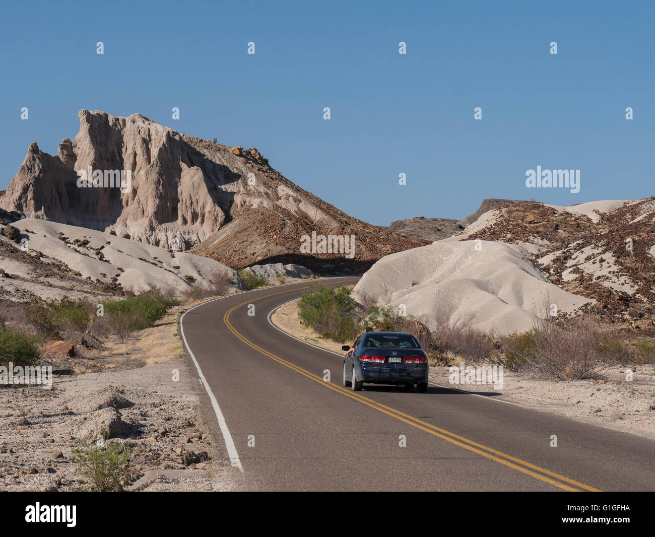 White volcanic tuff beds and black basaltic boulders, Ross Maxwell ...