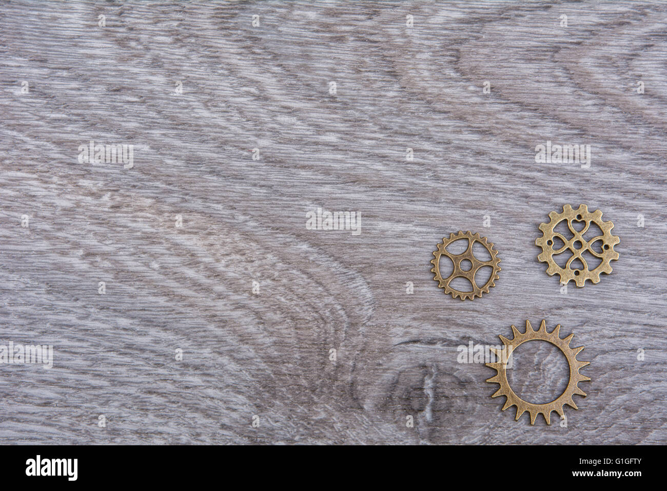 Small gears on grey hi-res stock photography and images - Alamy