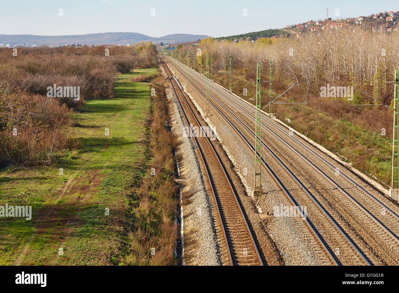 Railway tracks to the distance Stock Photo - Alamy