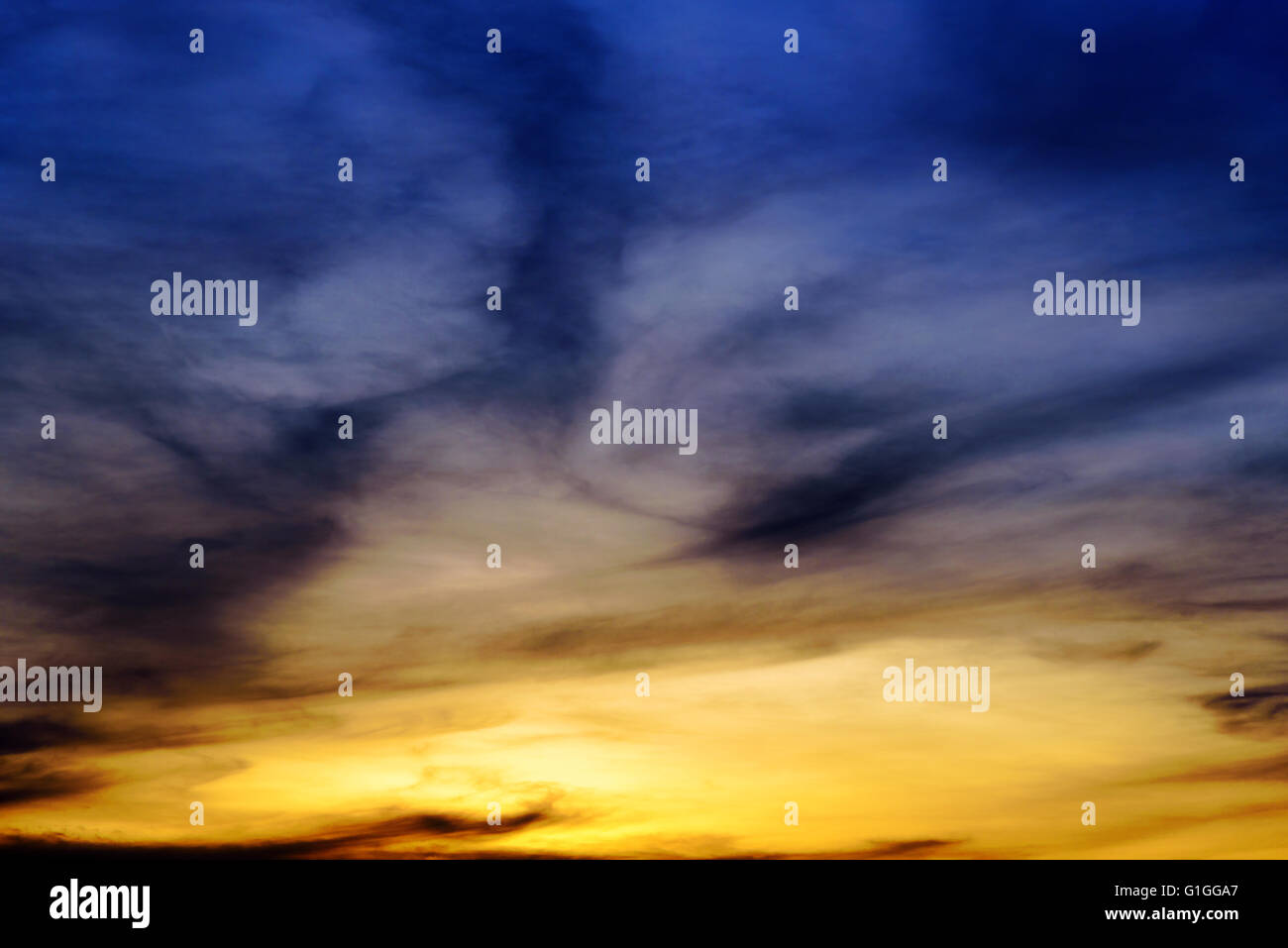 Blue and yellow sky at sunset. Background, texture Stock Photo - Alamy
