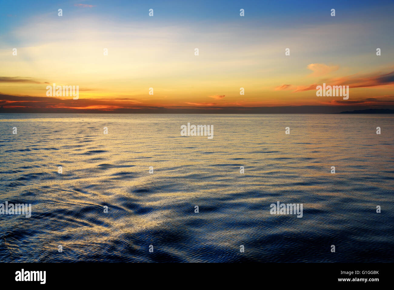 Beautiful sunset at the equator. View from ferry Stock Photo - Alamy