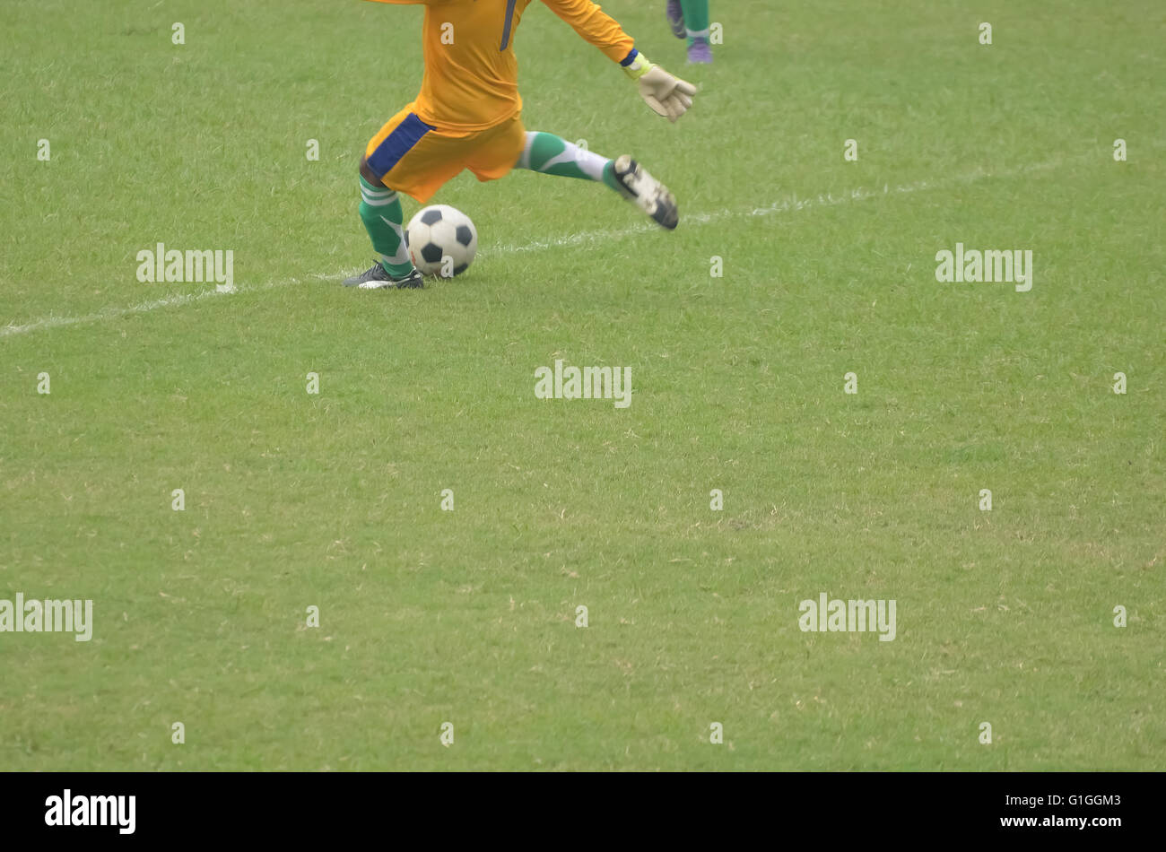 Boy is going to kick soccer ball Stock Photo - Alamy