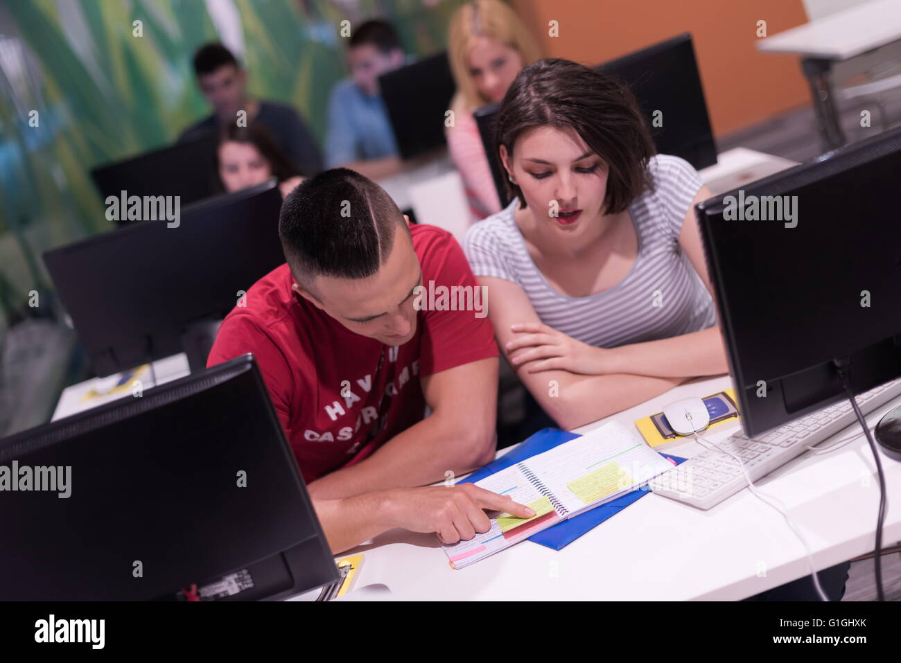 technology students group in computer lab school classroom working on ...