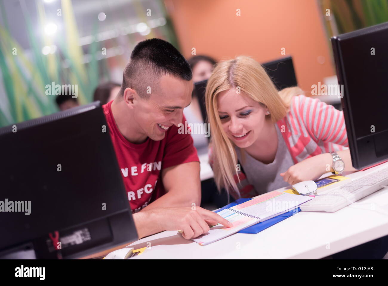 technology students group in computer lab school classroom working on ...