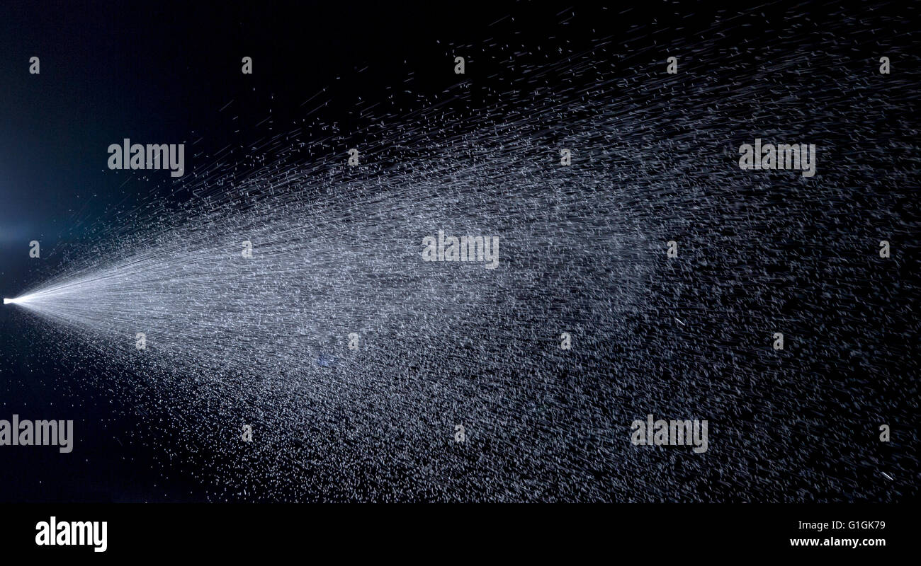 Water jet spraying on black background Stock Photo - Alamy