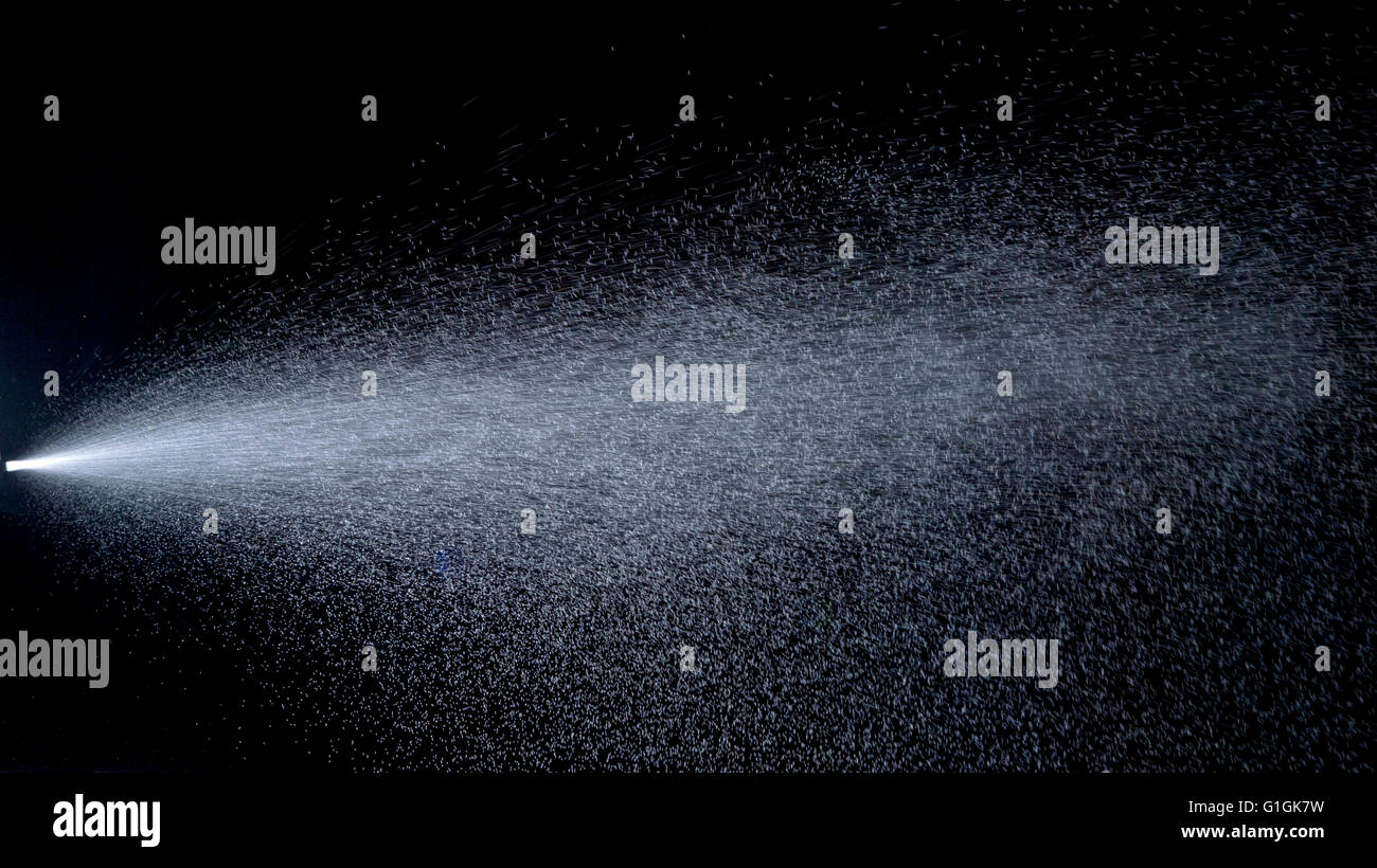 Water jet spraying on black background Stock Photo - Alamy