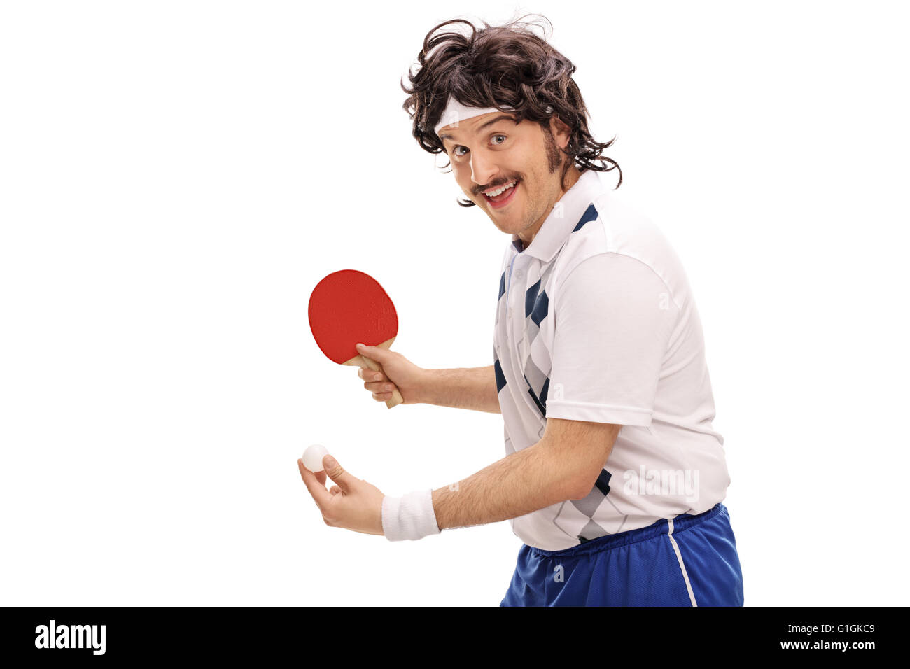 Young retro man playing table tennis and looking at the camera isolated ...