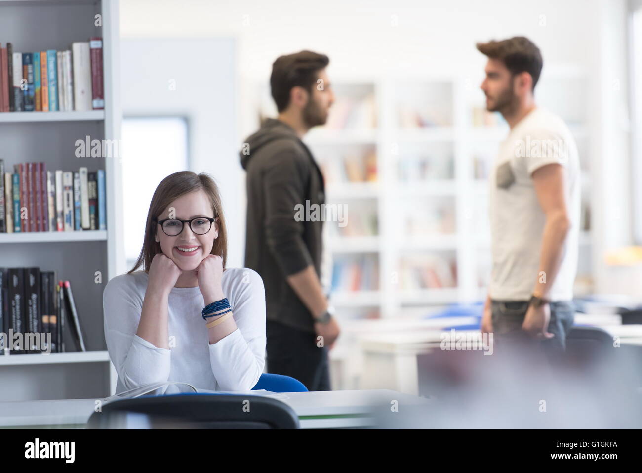 female smart looking student study in school library, group of students ...