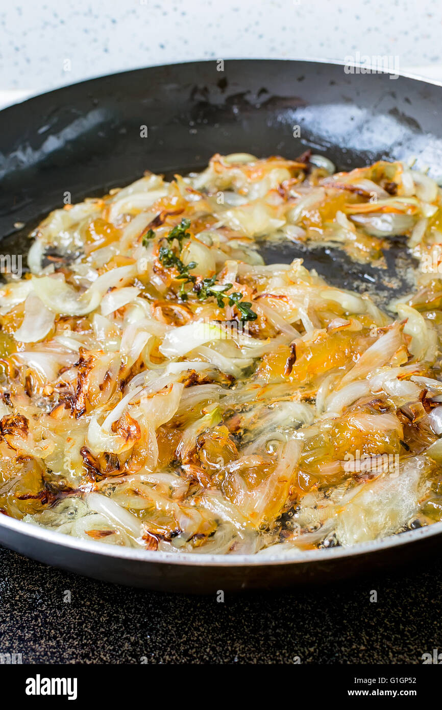Preparation of onion confit with fig jam and orange peel Stock Photo ...