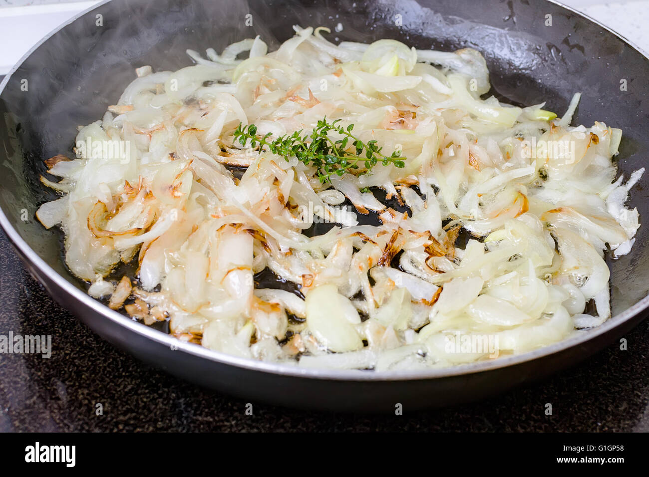 Preparation of onion confit with fig jam and orange peel Stock Photo ...