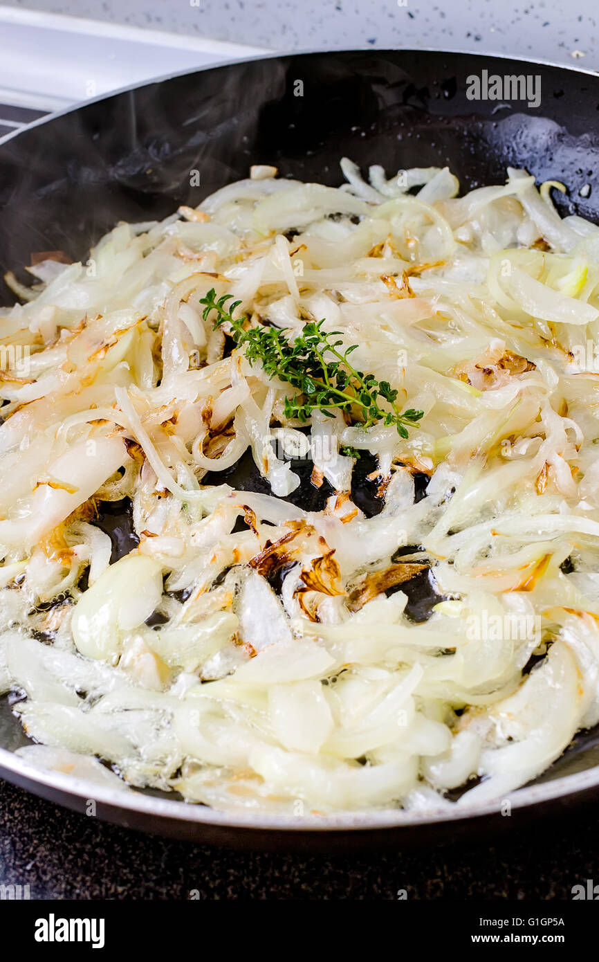 Preparation of onion confit with fig jam and orange peel Stock Photo ...