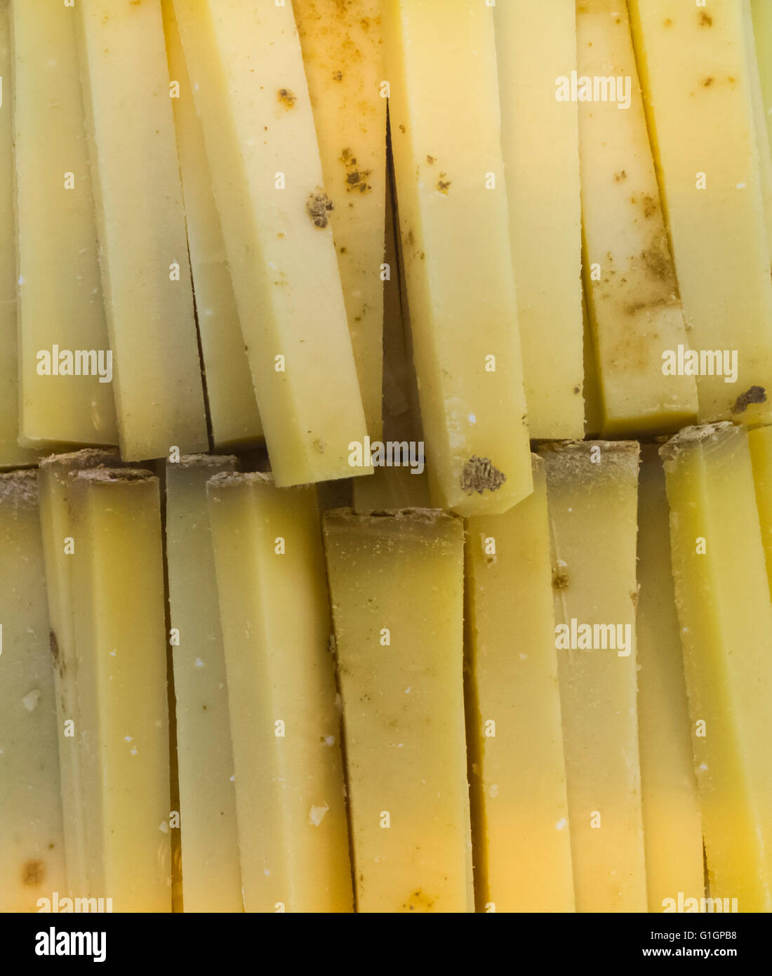 Ripped piece of yellow cheese and sorted in a parallel row Stock Photo ...