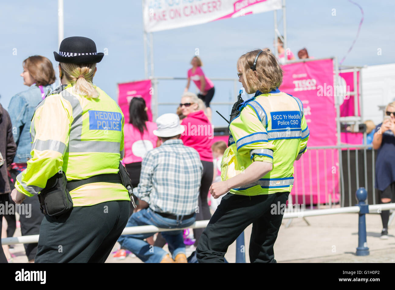 A police woman and a PCSO dancing as they show support during a cancer ...