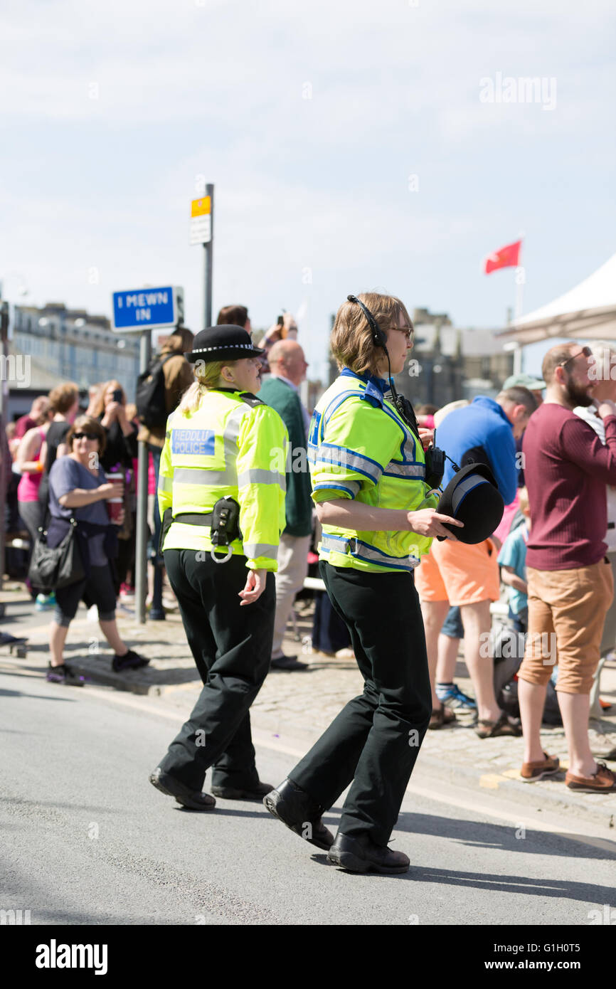 A police woman and a PCSO dancing as they show support during a cancer ...