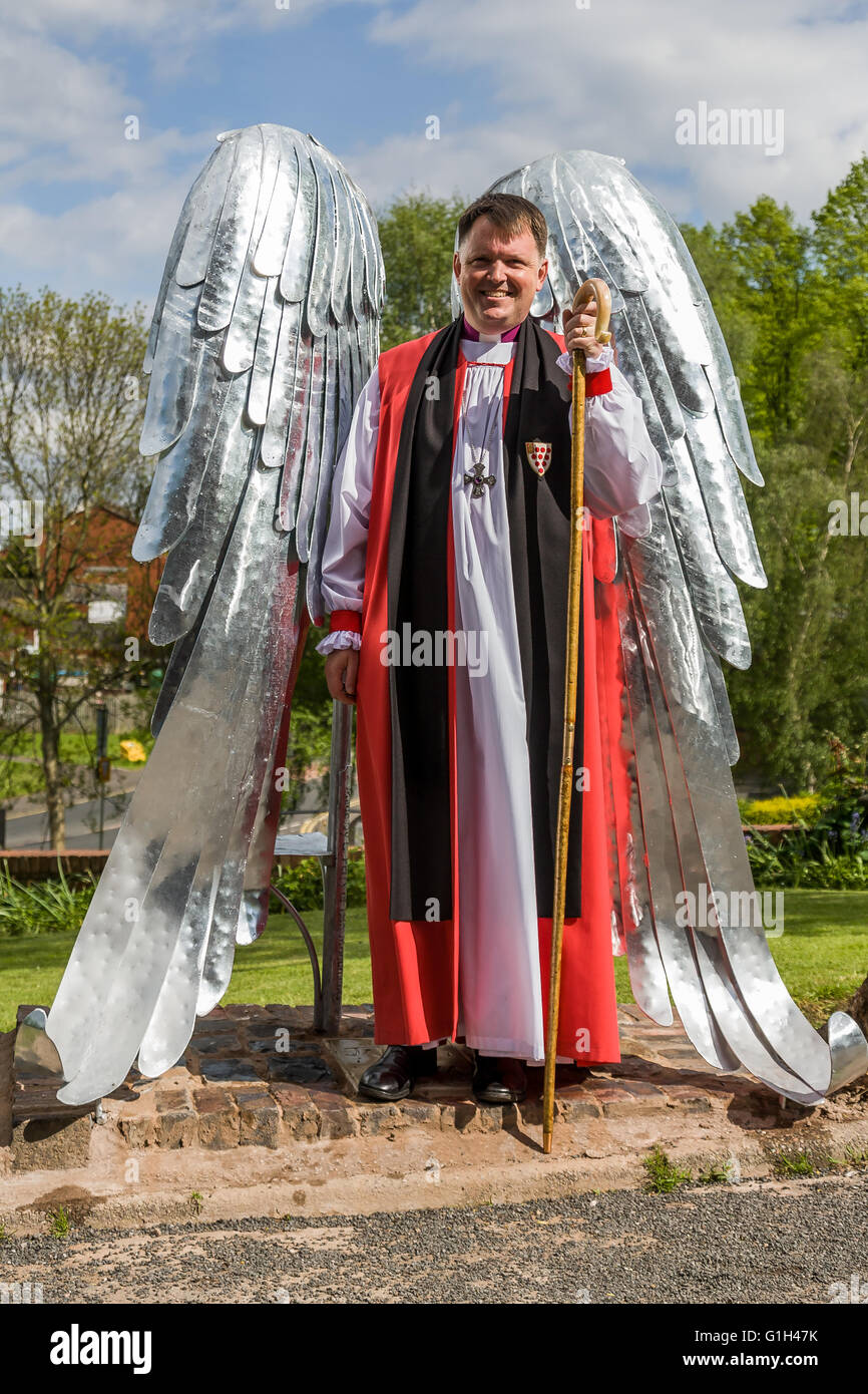 Bishop Graham Usher of Dudley, UK standing in front of a sculpture ...