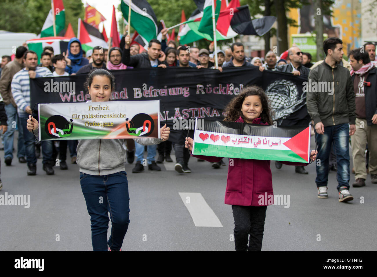 Two young girls hold banners calling for freedom for Palestine on Nakba ...